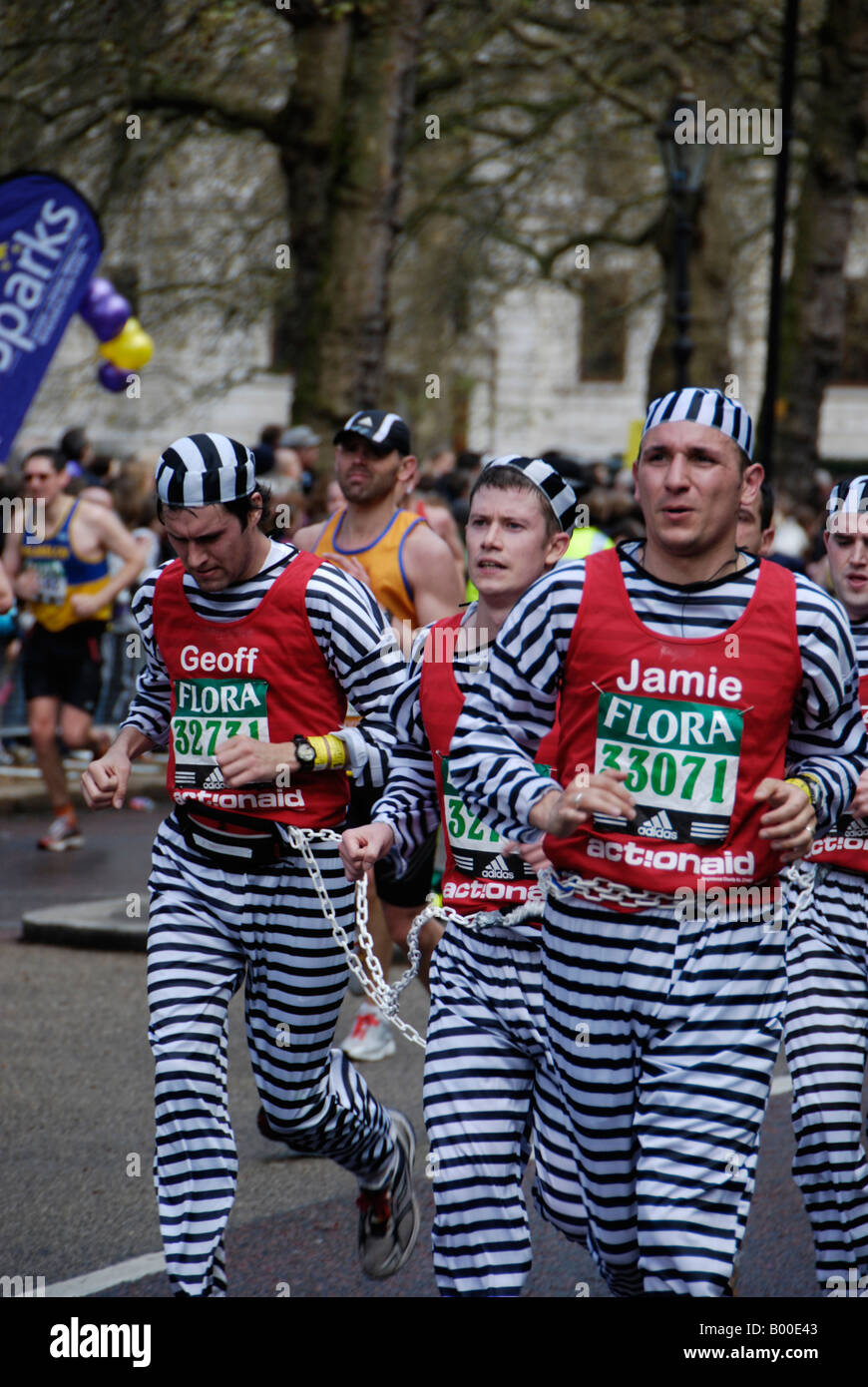 Runners dressed as chained convicts in the 2008 London Marathon Stock ...