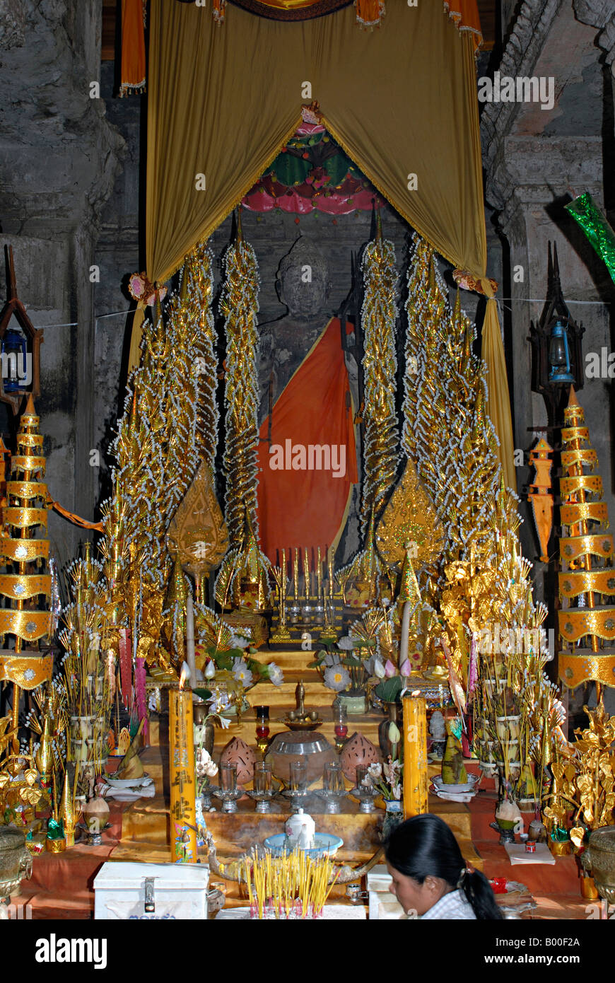 Cambodia, Angkor Wat. Standing Buddha in Worship. Upper level Stock ...