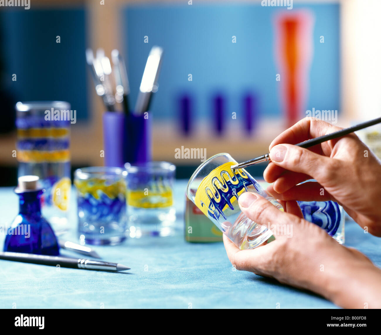 A photograph of a glass being painted in an artists studio Stock Photo ...