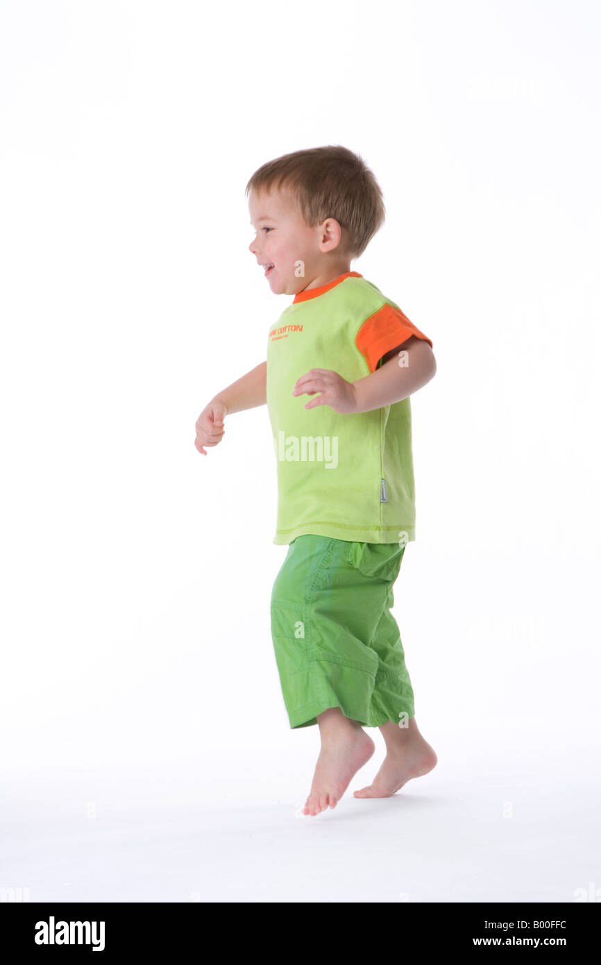 Little boy jumping around Stock Photo - Alamy