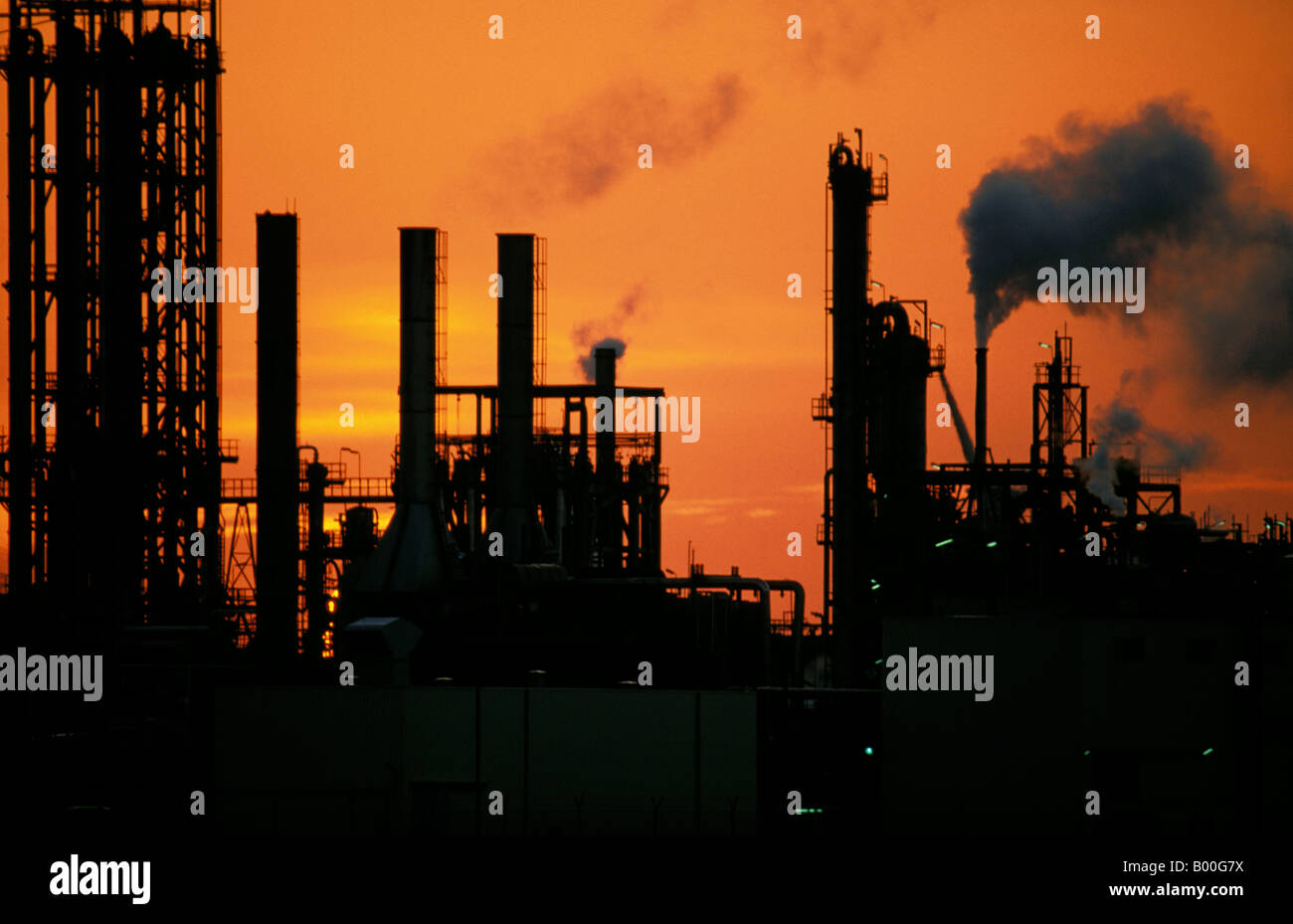 Port of Rotterdam refinery of Esso at sunrise Stock Photo - Alamy