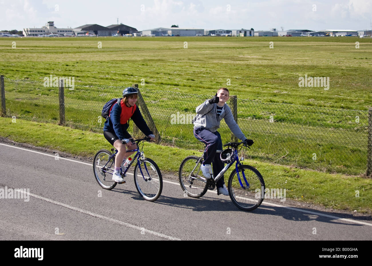 Adults cycling on road. Sussex England Stock Photo - Alamy