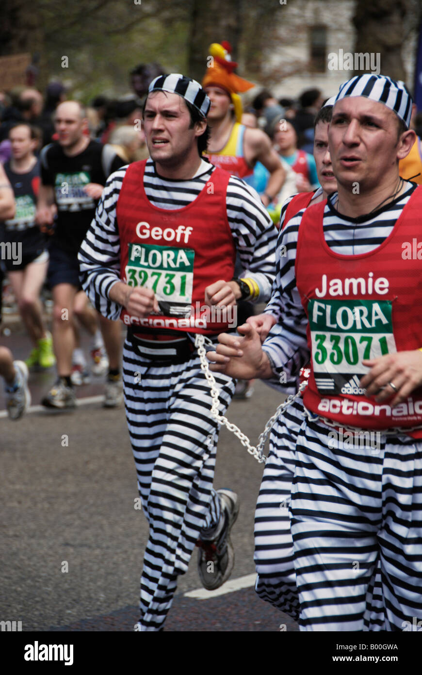 Runners dressed as chained convicts in the 2008 London Marathon Stock ...
