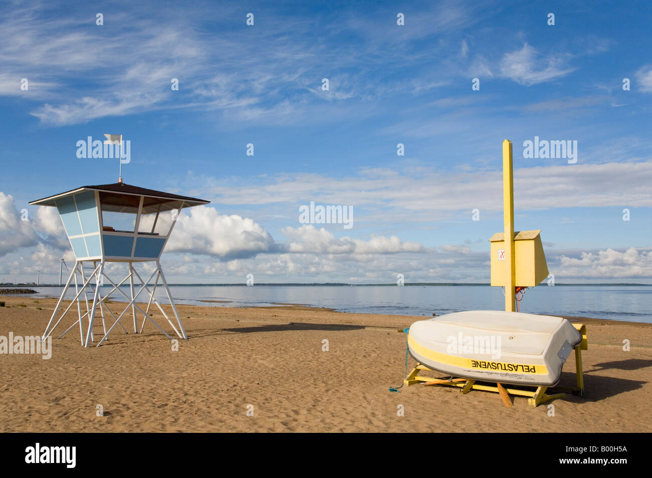Life guard's watch tower and small rescue boat / skiff / dinghy at ...