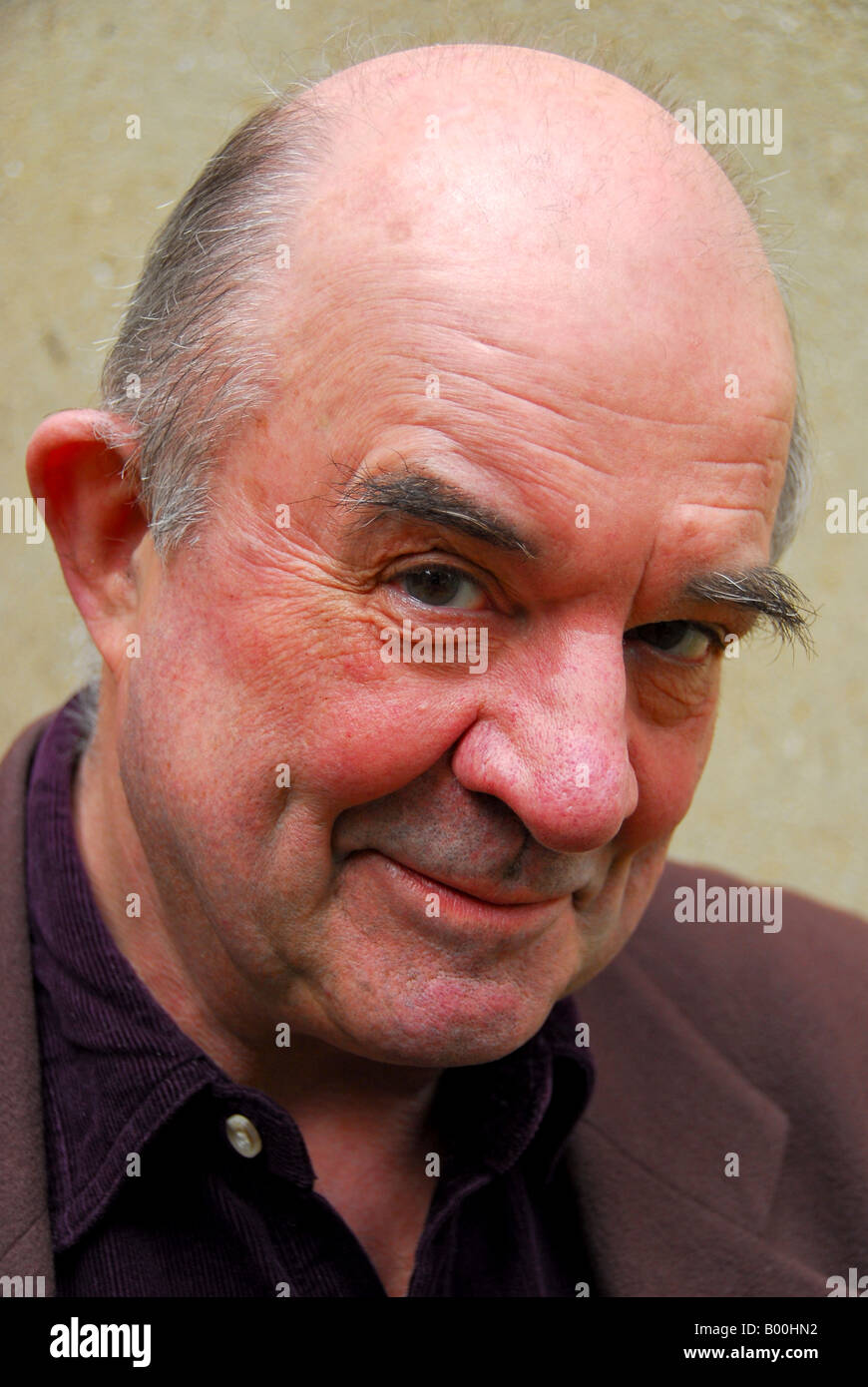MAN IN HIS LATE 60`s LOOKING CURIOUS Stock Photo - Alamy