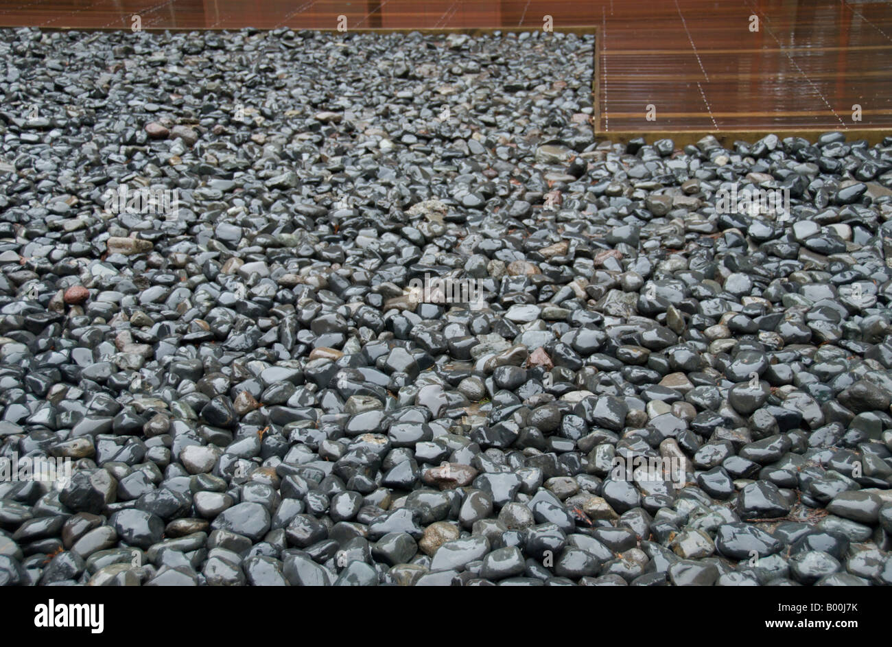 Wet pebbles and wooden decking at the Toshogu Shrine, Nikko, Japan ...