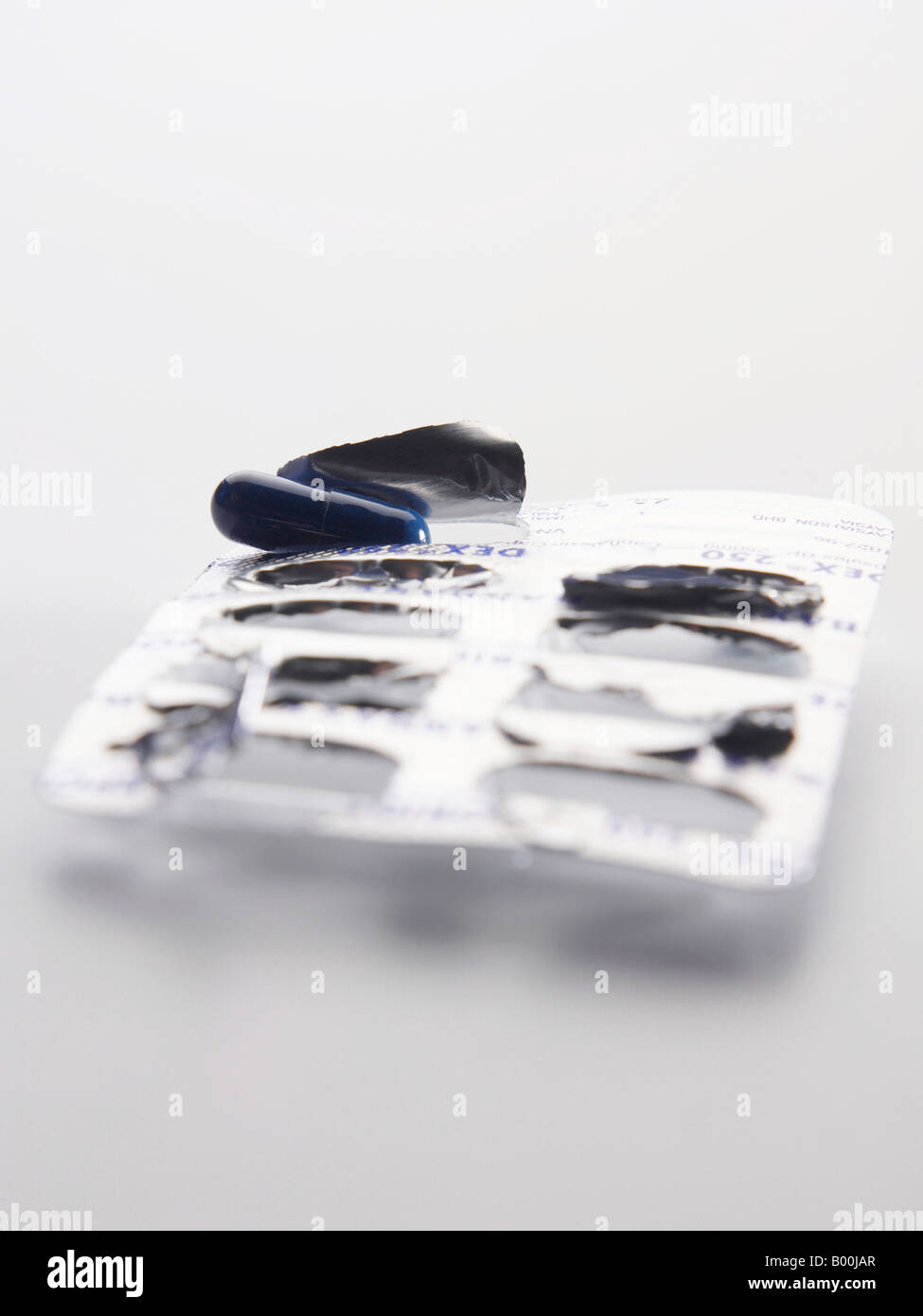 Capsules in and out of blister seal package Stock Photo - Alamy
