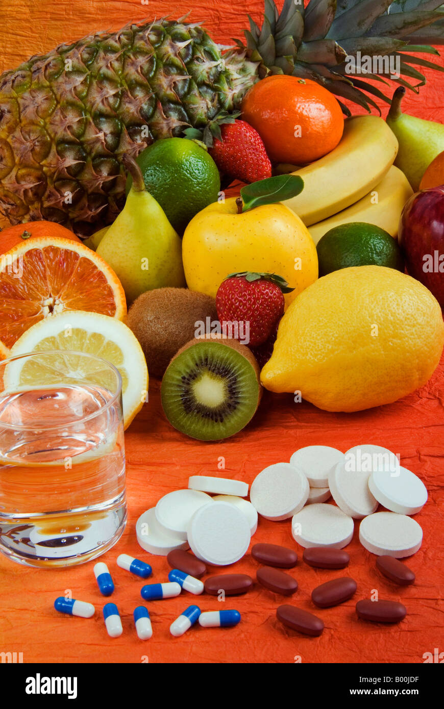 Vitamins and fresh fruits Stock Photo - Alamy