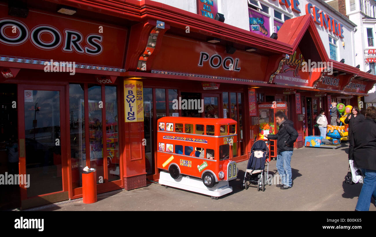 People standing outside slot machine amusements Stock Photo - Alamy