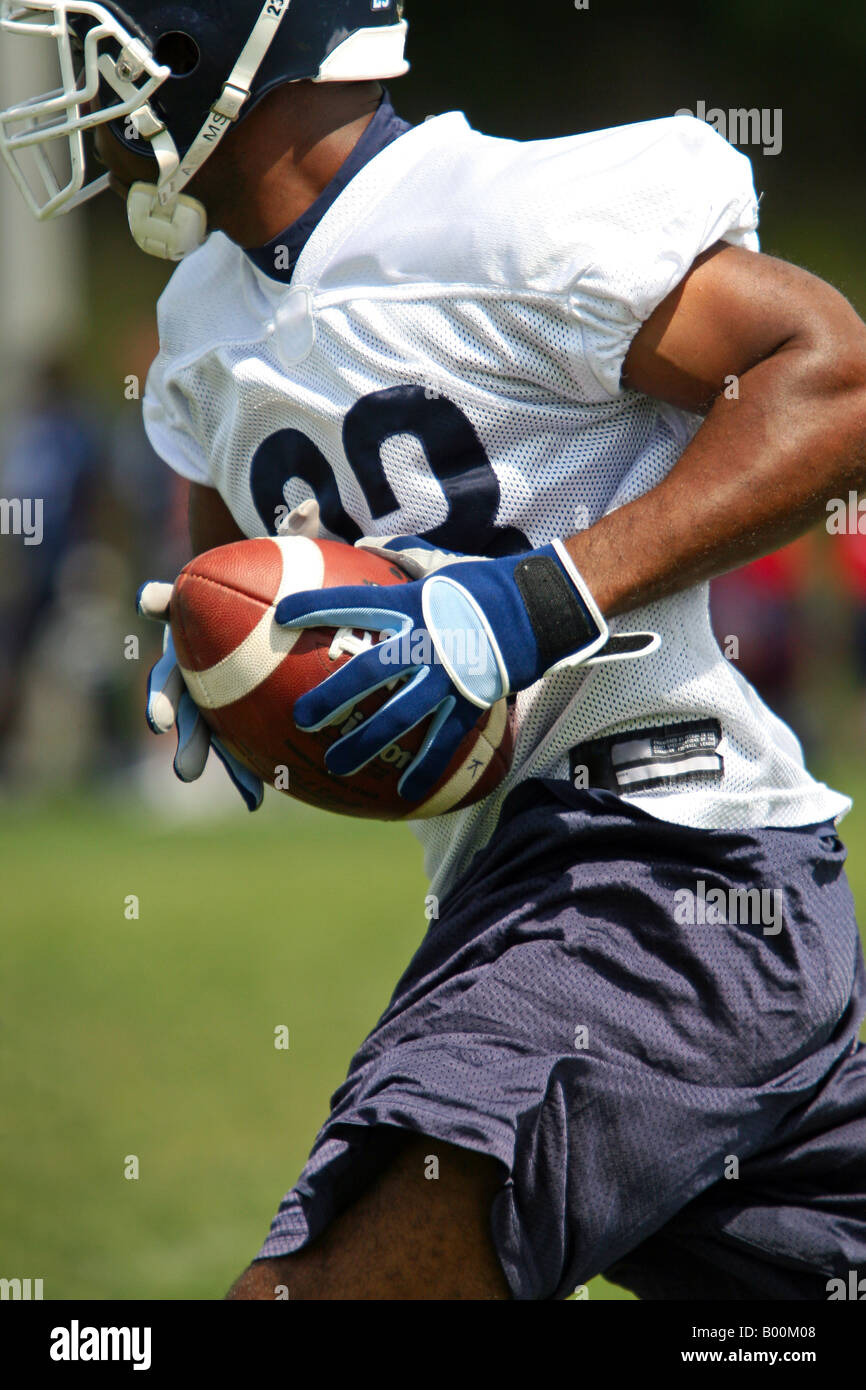 Football Player with football in hand Stock Photo - Alamy