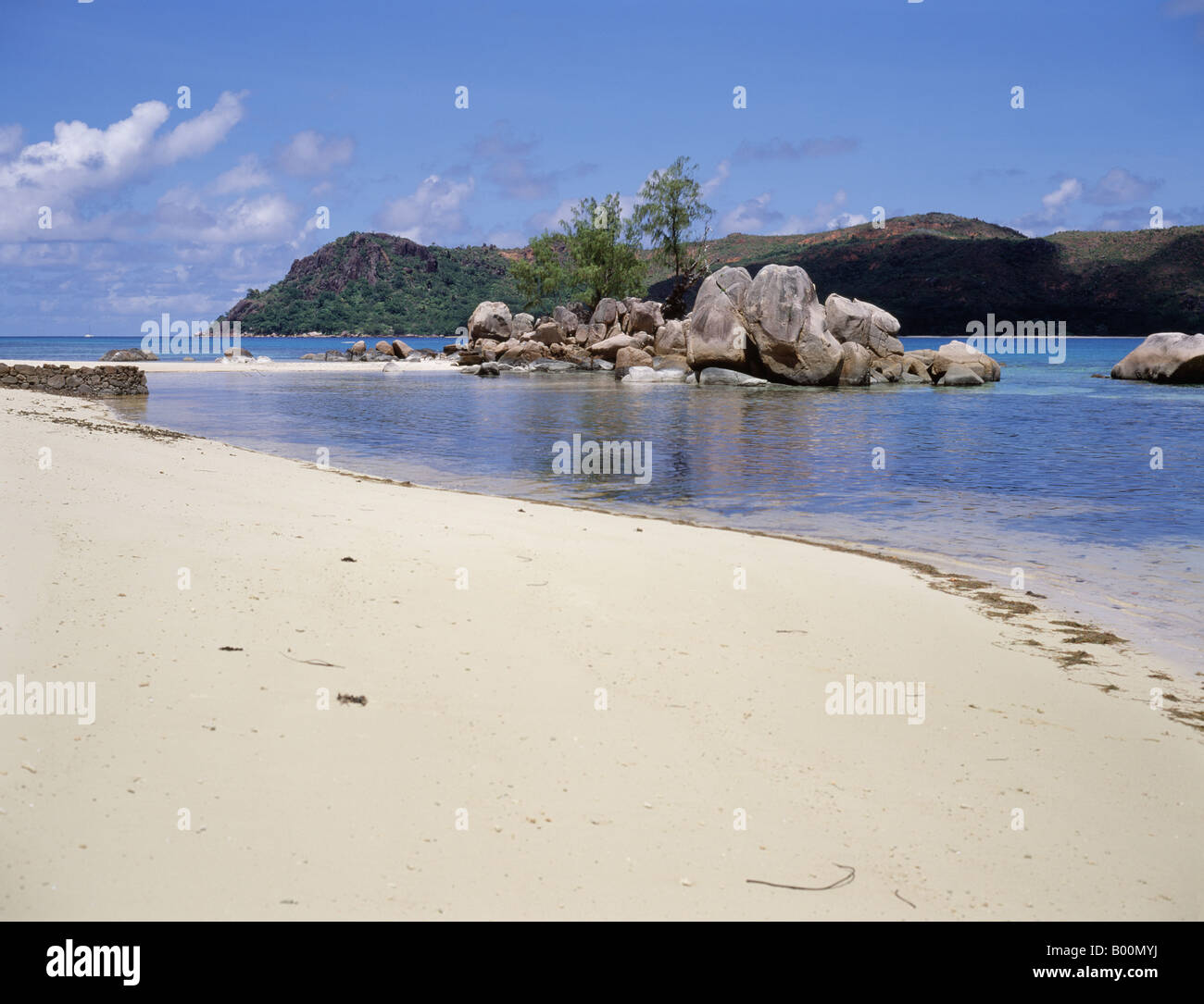 Indian Ocean Lagoon Small islet of granite pale blue in sea water ANSE ...