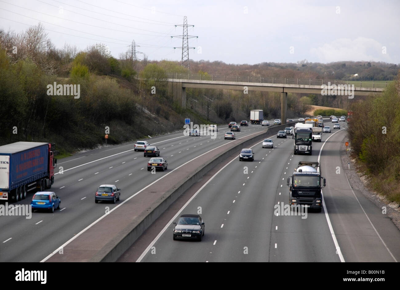 M25 near J17 Northbound showing flowing rushhour traffic, a bridge and ...