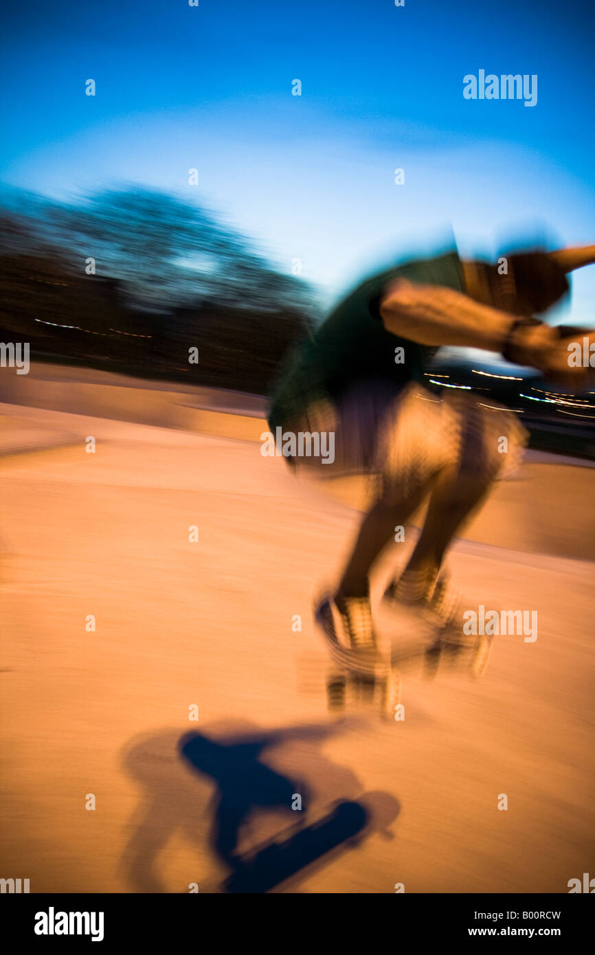 Male skateboarder jumping at night in a skate park Chicago Illinois ...