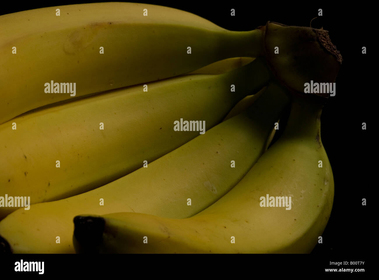 A low key image of a bunch of bananas Stock Photo - Alamy