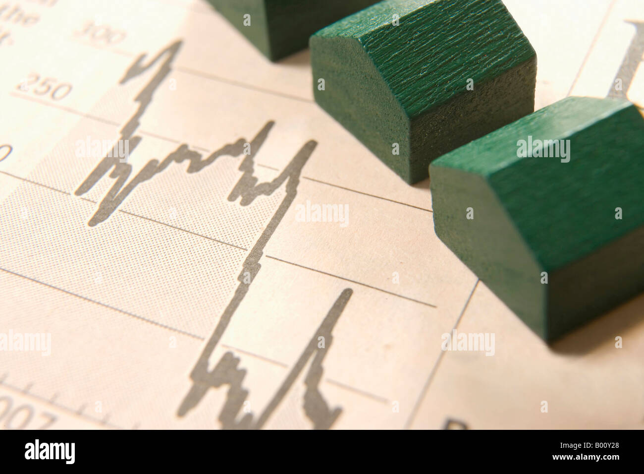 graph in a paper with wooden houses Stock Photo - Alamy
