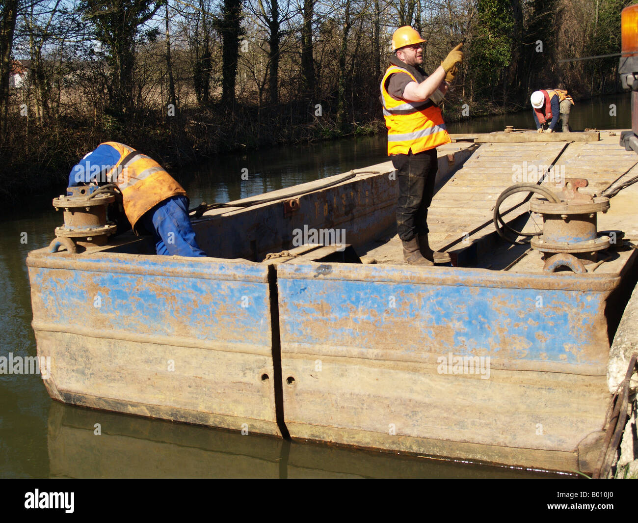 interlocking 2 halves of mobile river dredger boat Stock Photo - Alamy