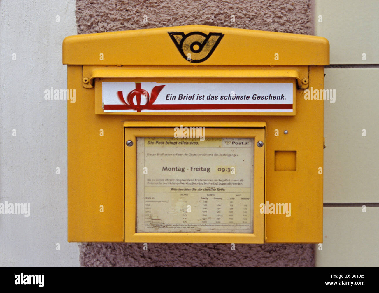 Yellow mail box of the Austrian post office Stock Photo - Alamy