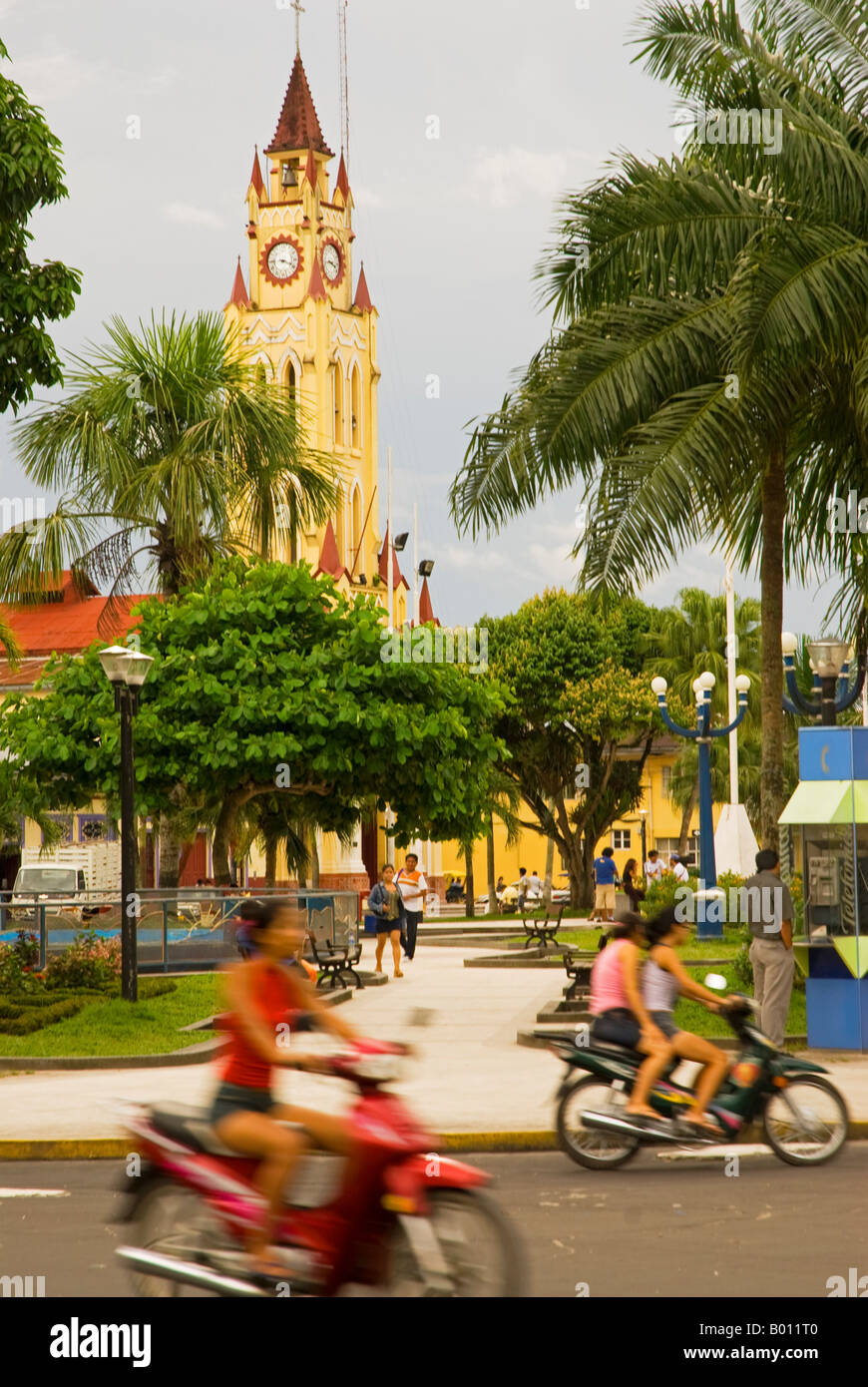 Peru, Amazon, Amazon River. Traffic passing through the City Square in ...