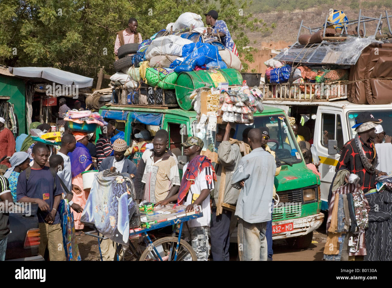 Mali, Bamako. A busy scene at one of Bamako’s country bus stations ...