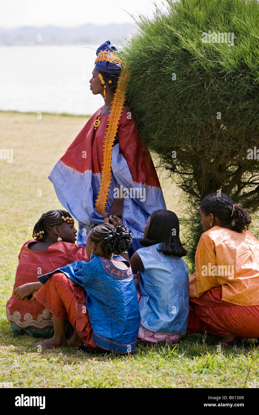 Mali, Bamako. A group of smartly-dressed Malian women in brightly ...