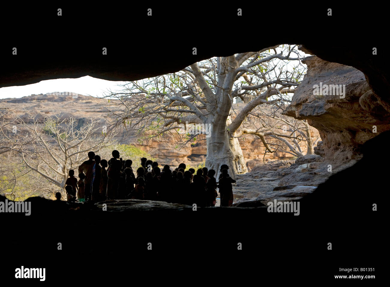 Mali, Dogon Country. Children gather at the entrance to Bongo tunnel ...
