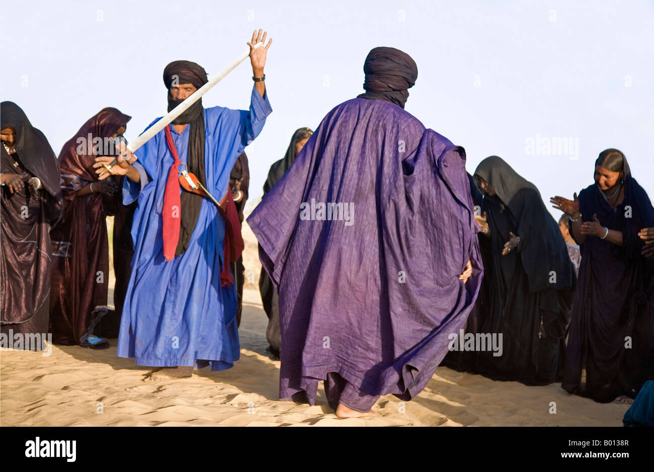 Mali, Timbuktu. A group of Tuareg men and women sing and dance near ...