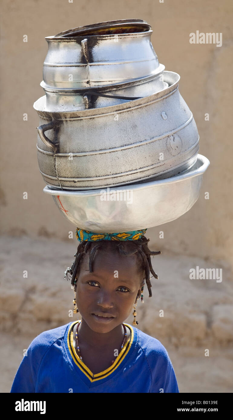 Mali, Niger Inland Delta. A young girl at Kotaka returns from the Niger ...