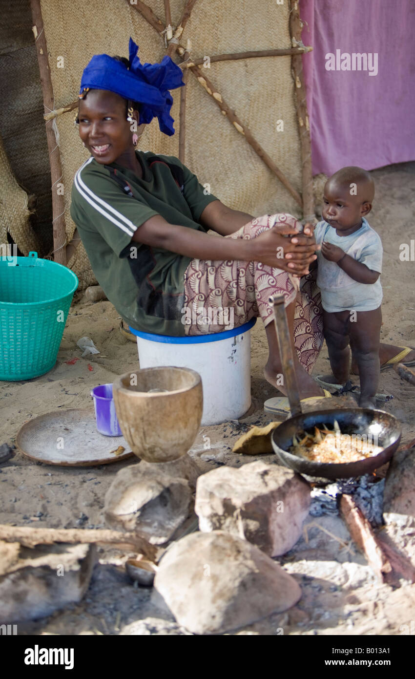 Woman frying fish hi-res stock photography and images - Alamy