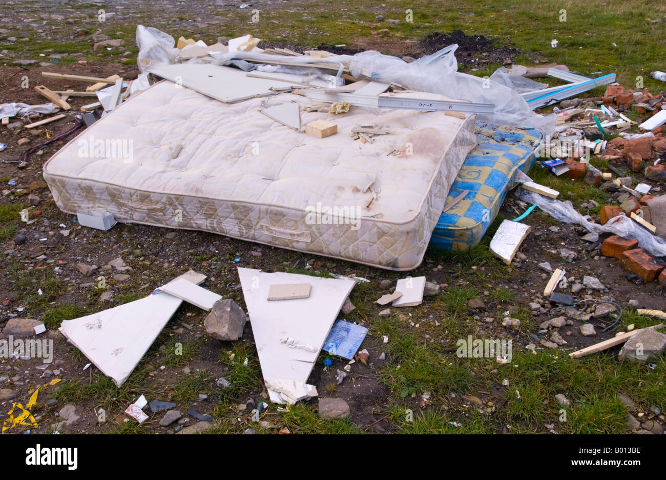 Builders rubble and domestic household waste dumped in countryside in ...
