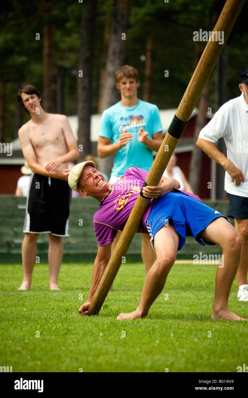 throwing heavy poles at the gotland games in Sweden Stock Photo - Alamy