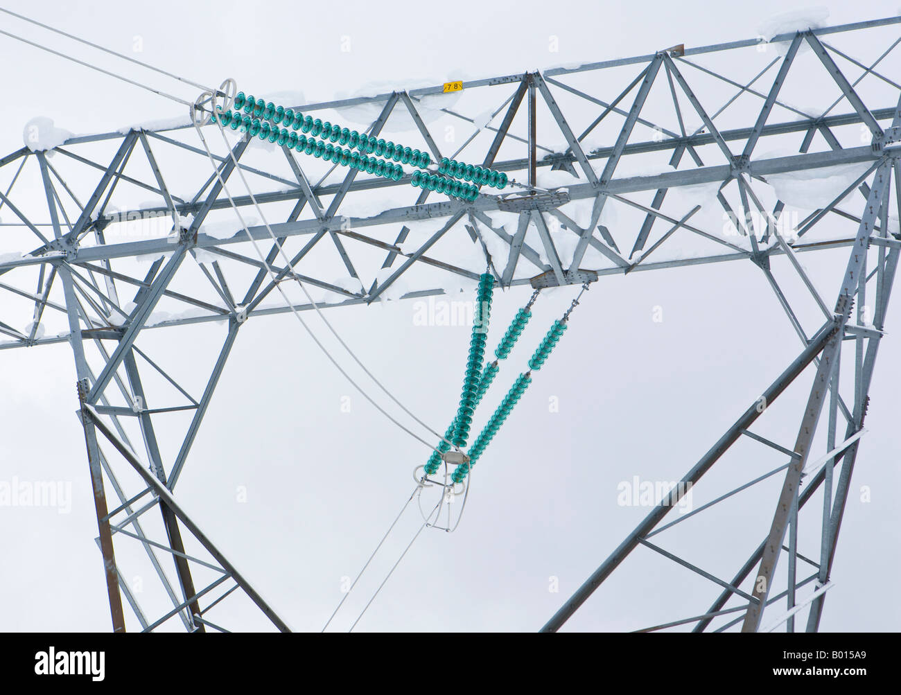 High tension power line structure with snow and ice on it Stock Photo ...