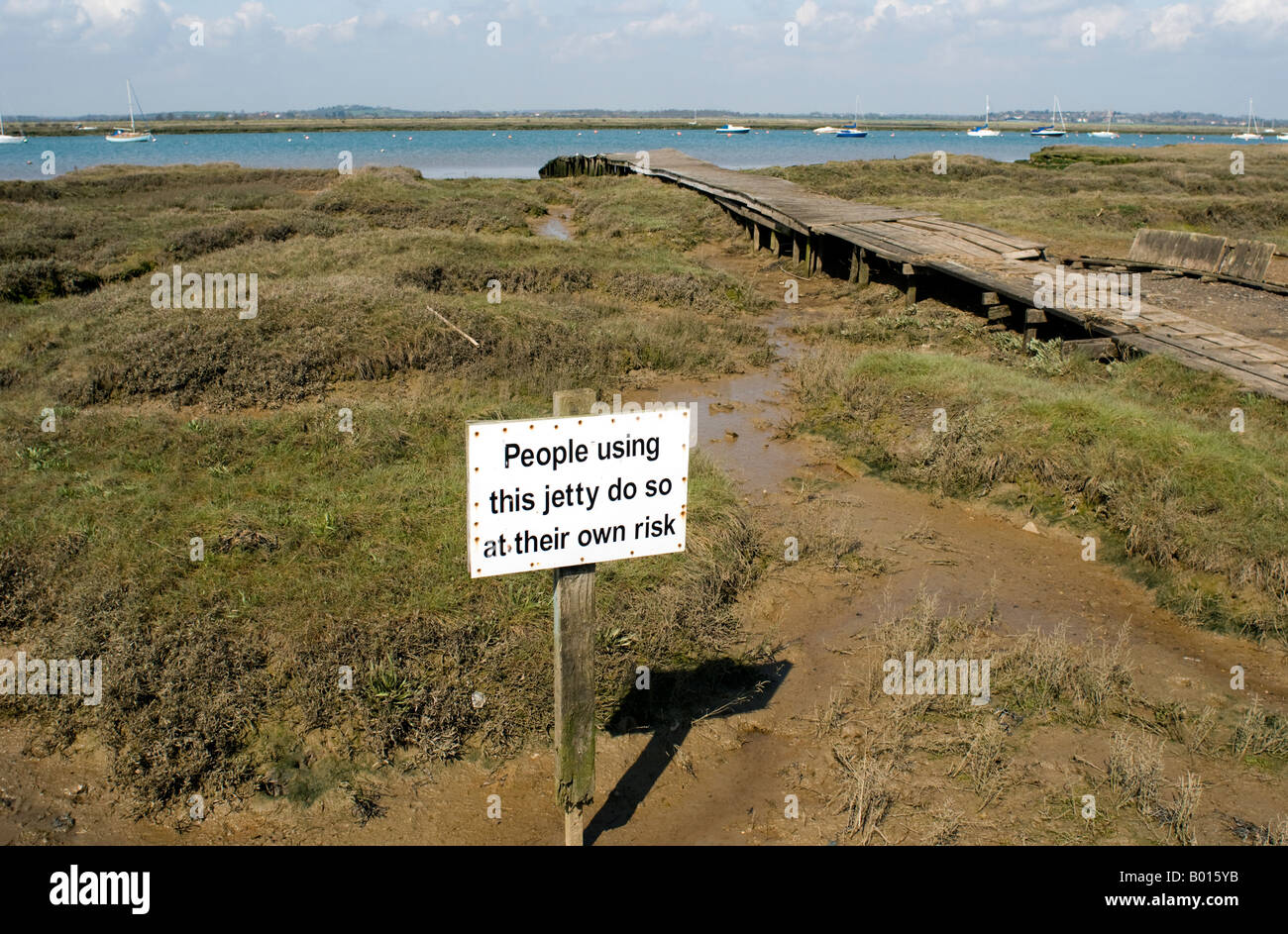 Sign giving warning about unstable jetty Stock Photo - Alamy