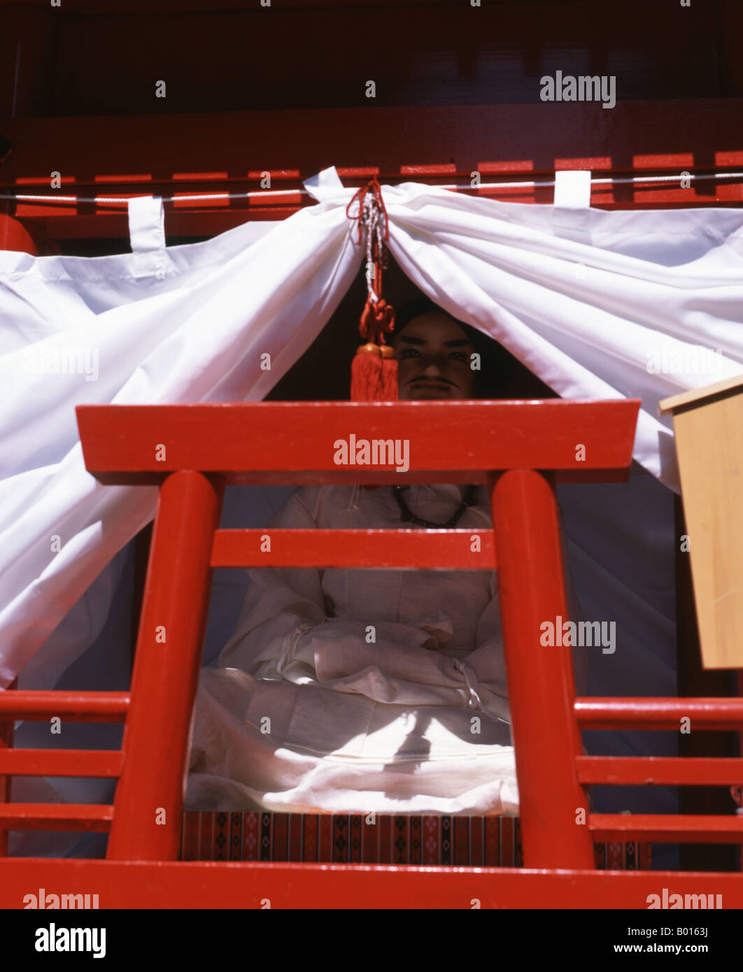 Prince doll inside the Mikoshi (portable shrine) at Honensai Festival ...