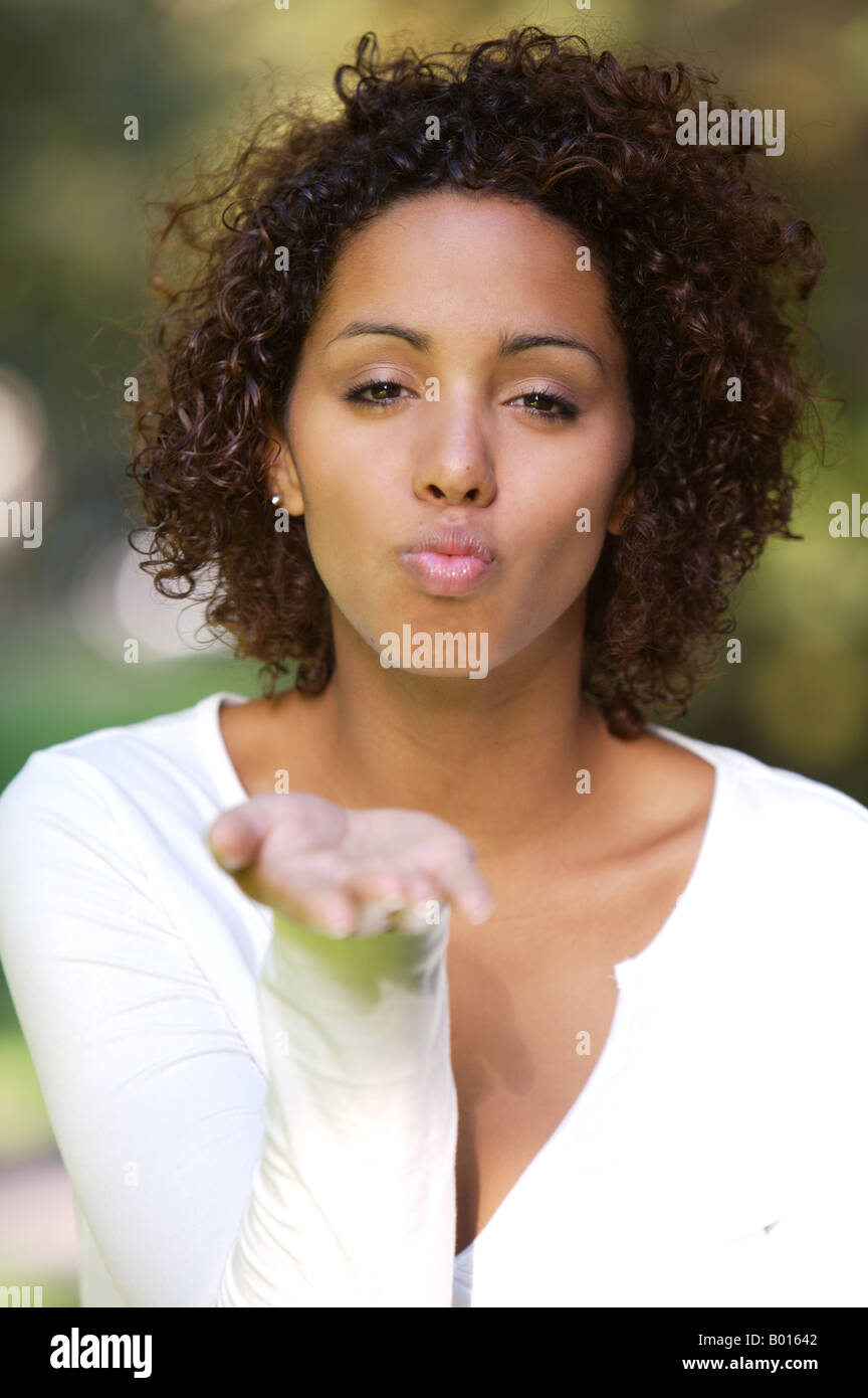 Young African mulata woman - half German half Cuban - blowing a kiss ...