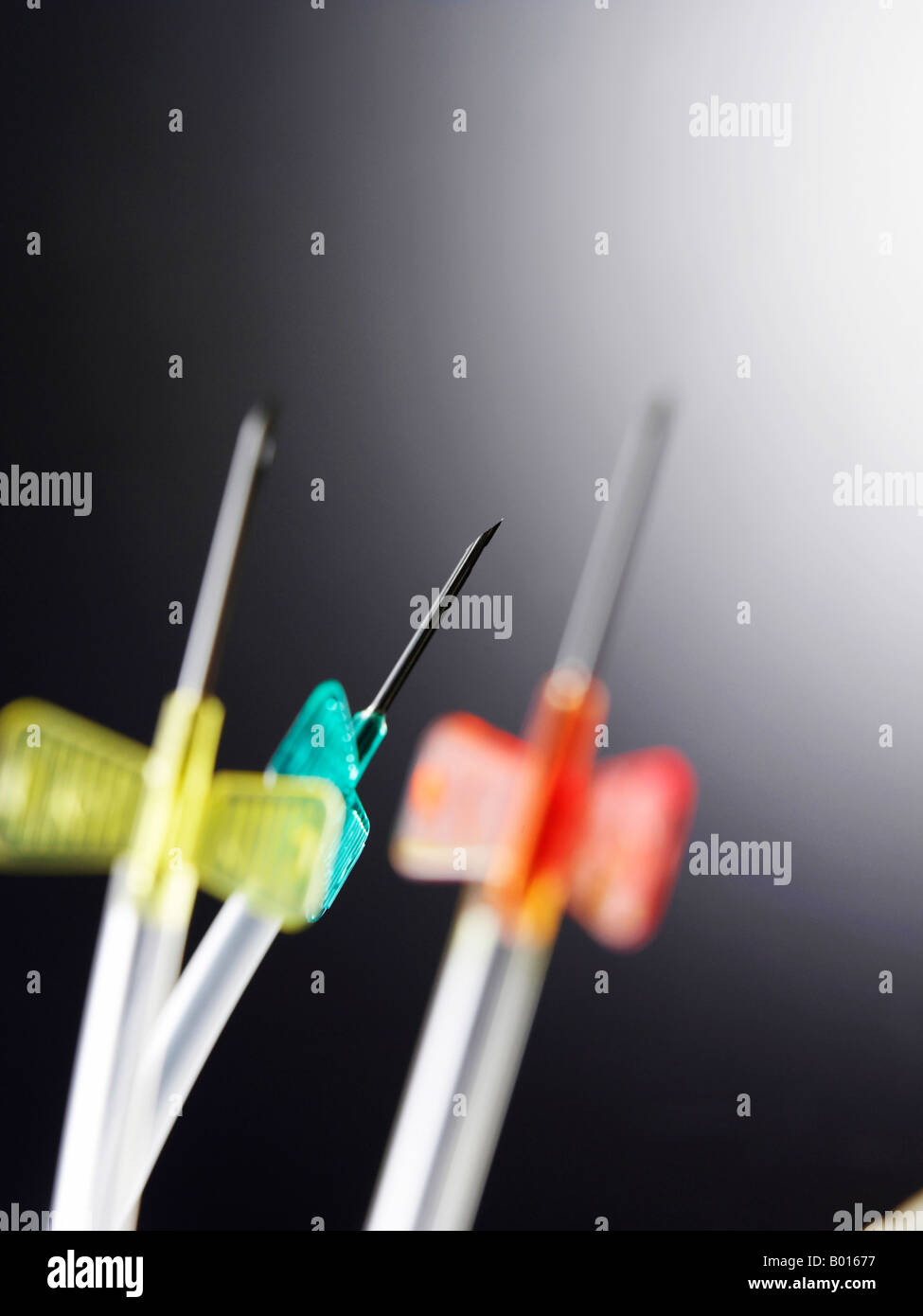 Butterfly intravenous needles pointing up Stock Photo - Alamy