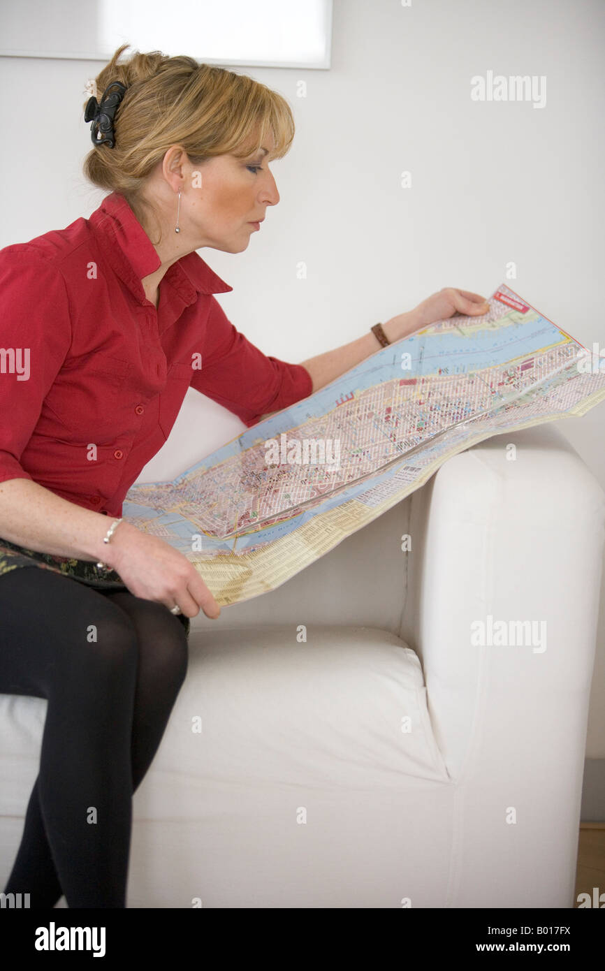 Senior woman reading a map Stock Photo - Alamy