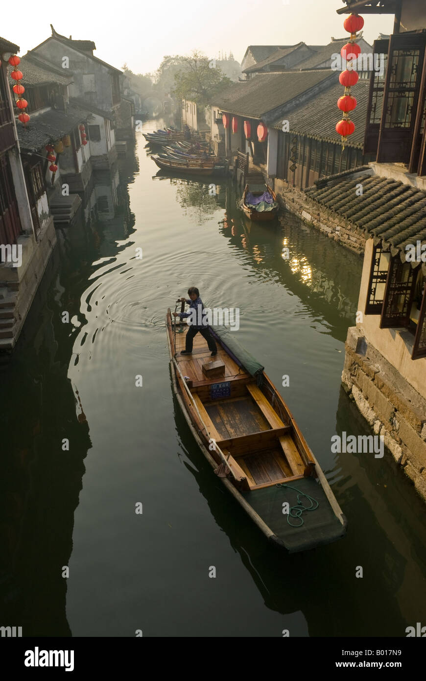 Rowboat on canal of historic water town, Zhouzhuang, Jiangsu Province ...