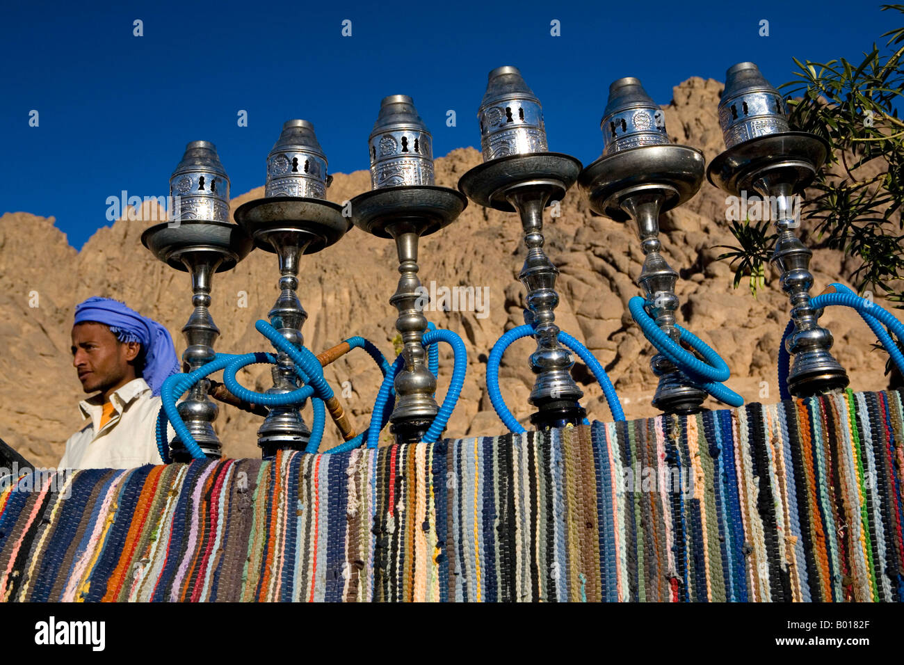 Egyptian with a collection of sheesha Water pipes in Bedouin camp in ...