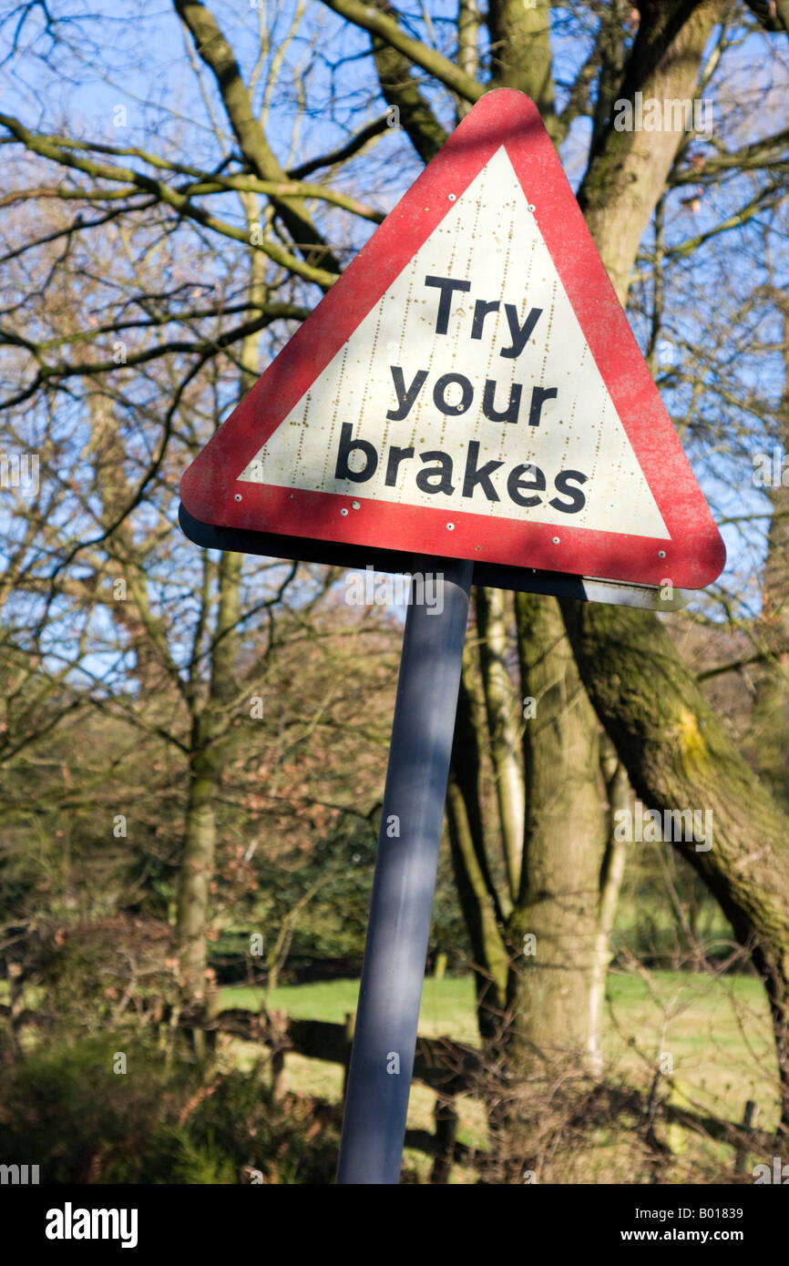 Try Your Brakes triangle UK road sign post Stock Photo - Alamy