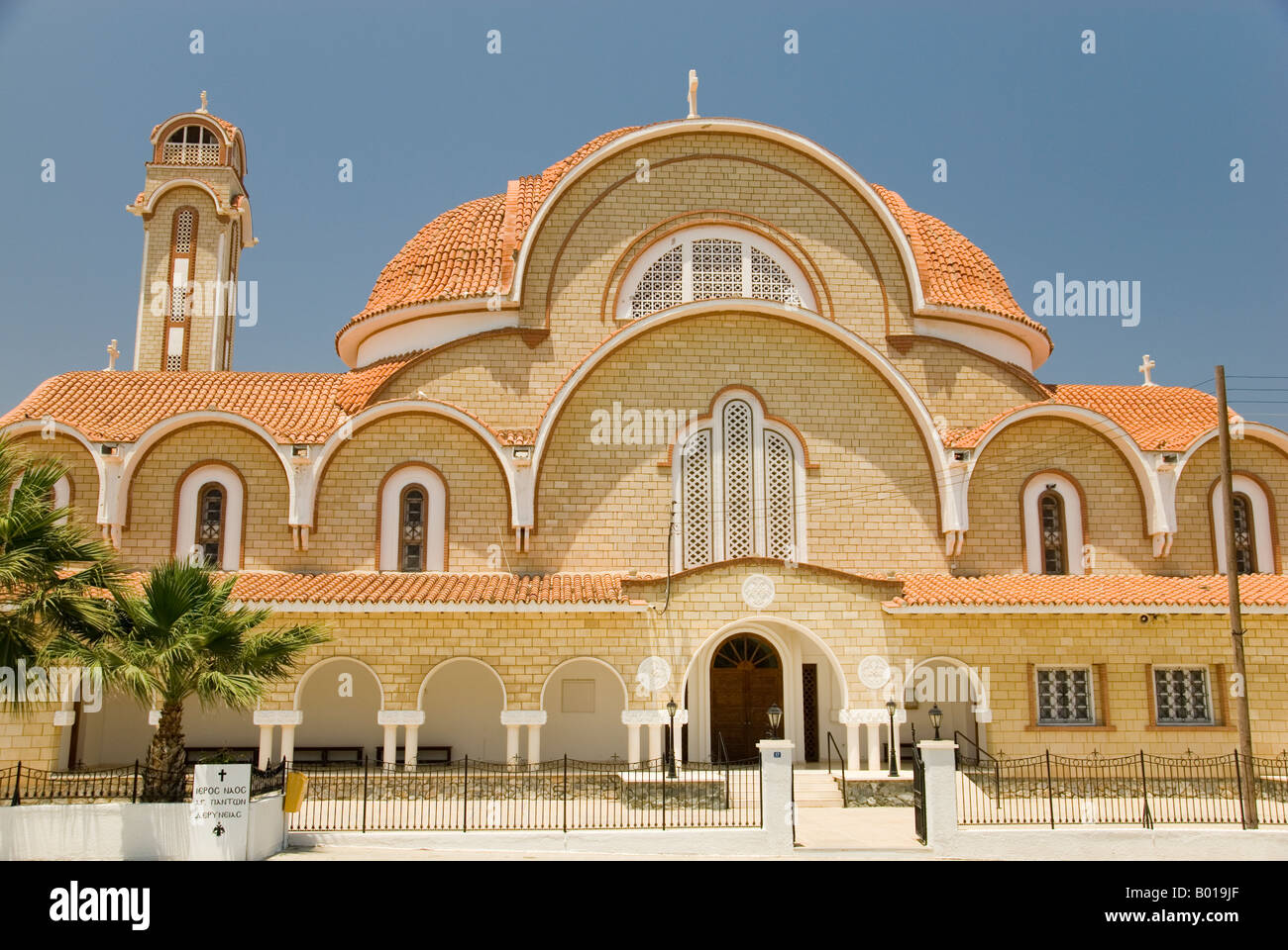 White and Pink Brick Church with Dome Curving Roof and Bell Tower ...