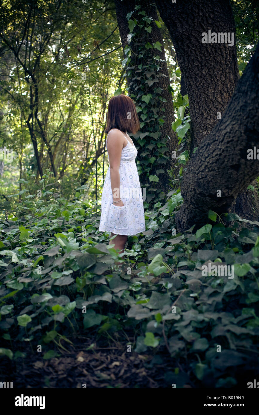 Young woman looking back Stock Photo - Alamy