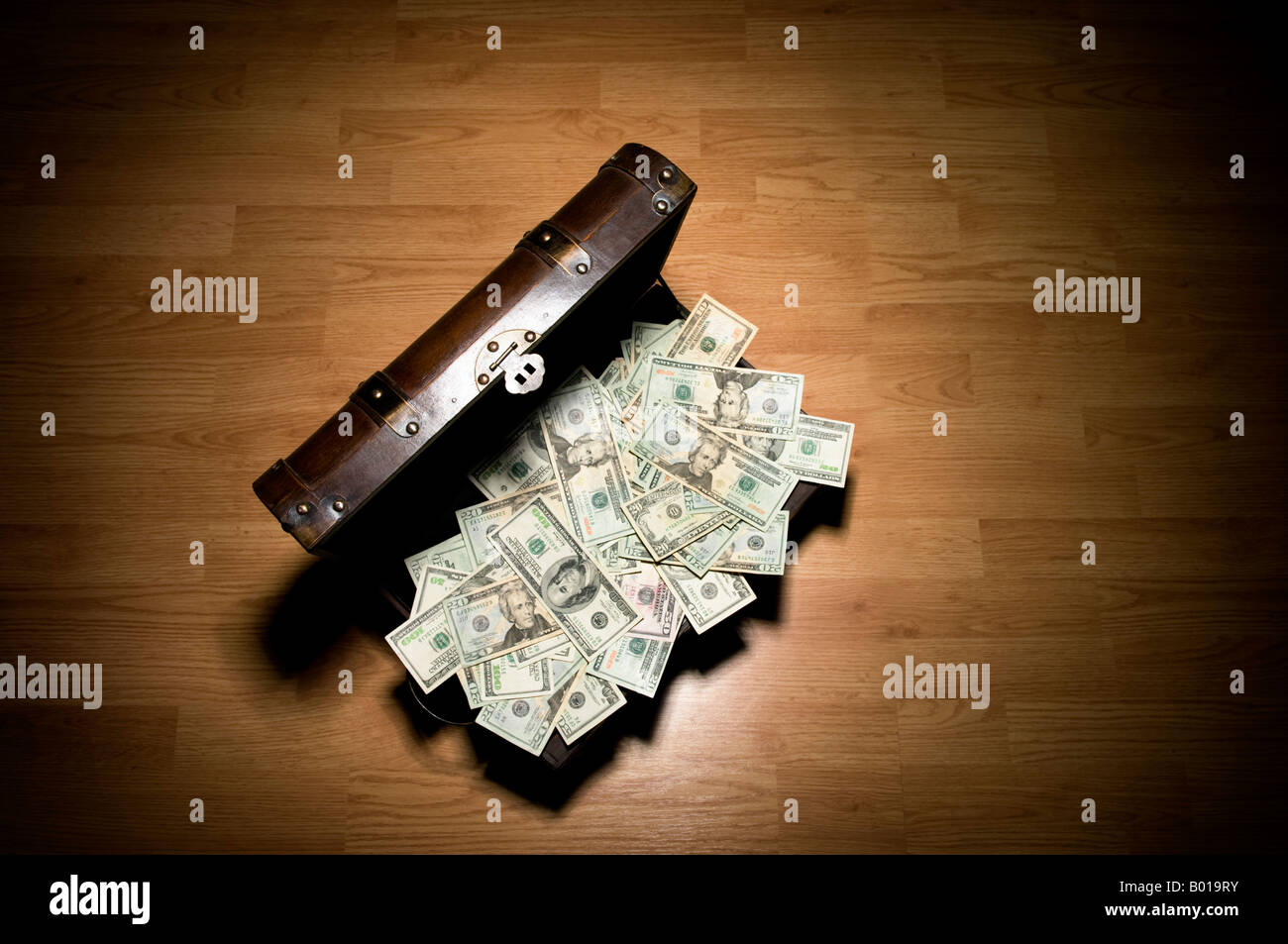 Treasure chest full of money Stock Photo - Alamy