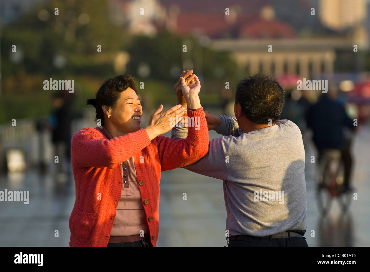 Couple dances for exercise during early morning, The Bund, Shanghai ...