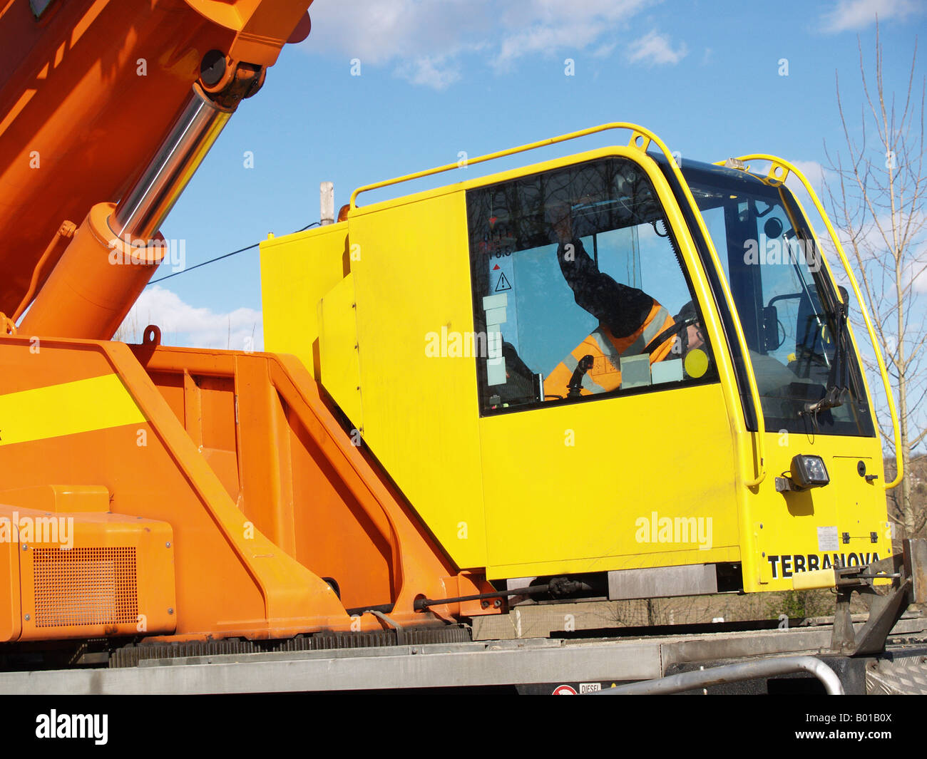 orange extension driver crane jib yellow cabin Stock Photo - Alamy