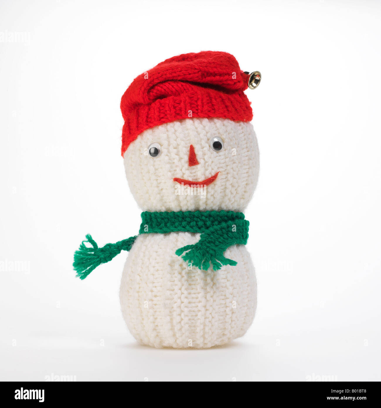 knit snowman with red cap and green scarf Stock Photo - Alamy