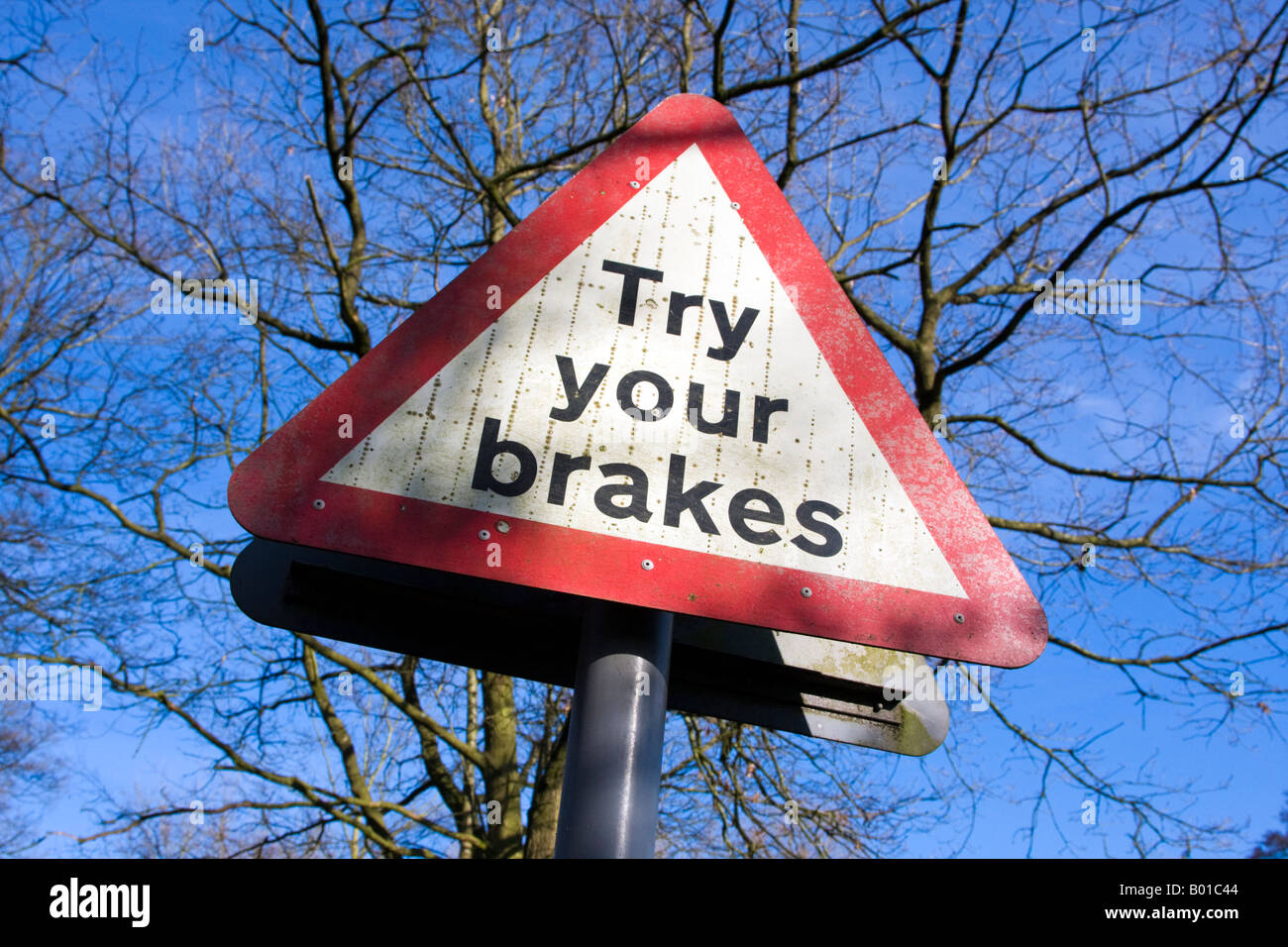 Try Your Brakes triangle UK road sign post Stock Photo - Alamy