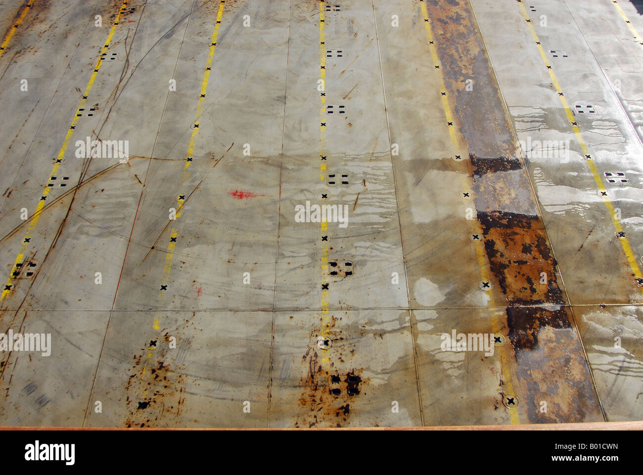 Rust and paint lines make a pattern on a cargo ship deck Stock Photo ...