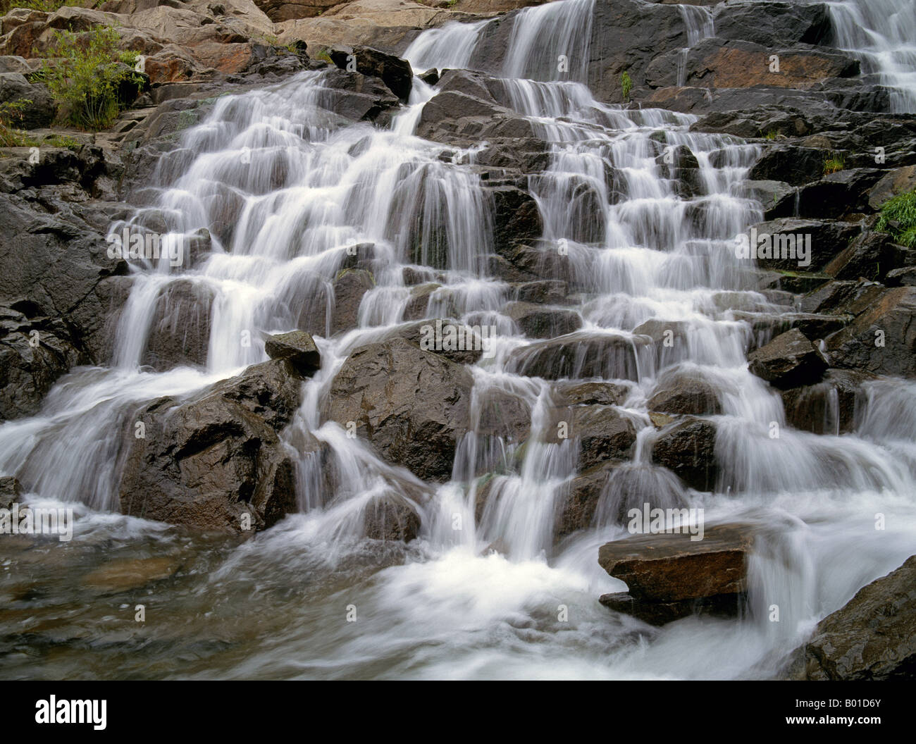 Portrait of a small but beautiful waterfall in the Sacramento Mountains ...