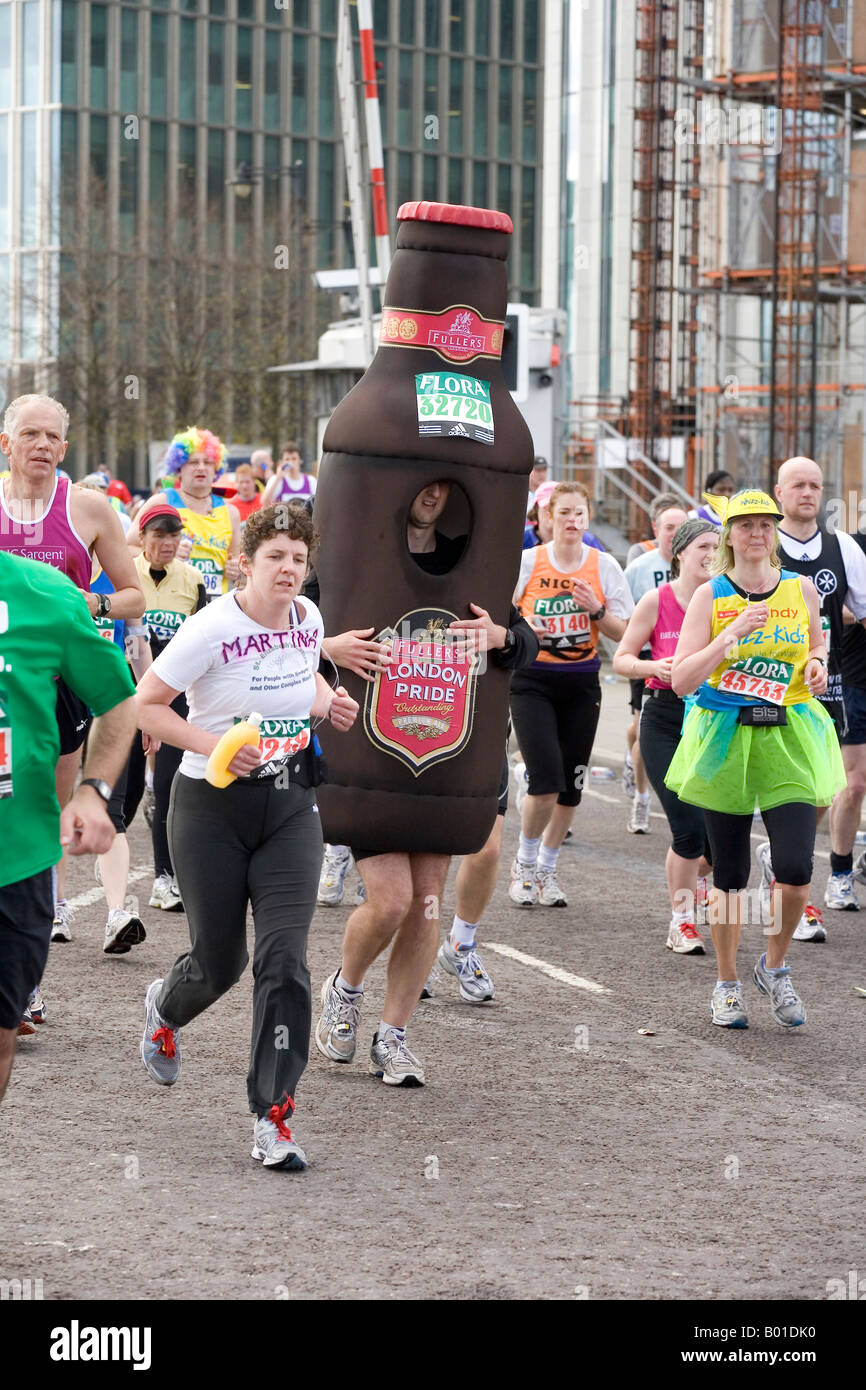 Fancy dress man dressed as a bottle of beer running in the London ...