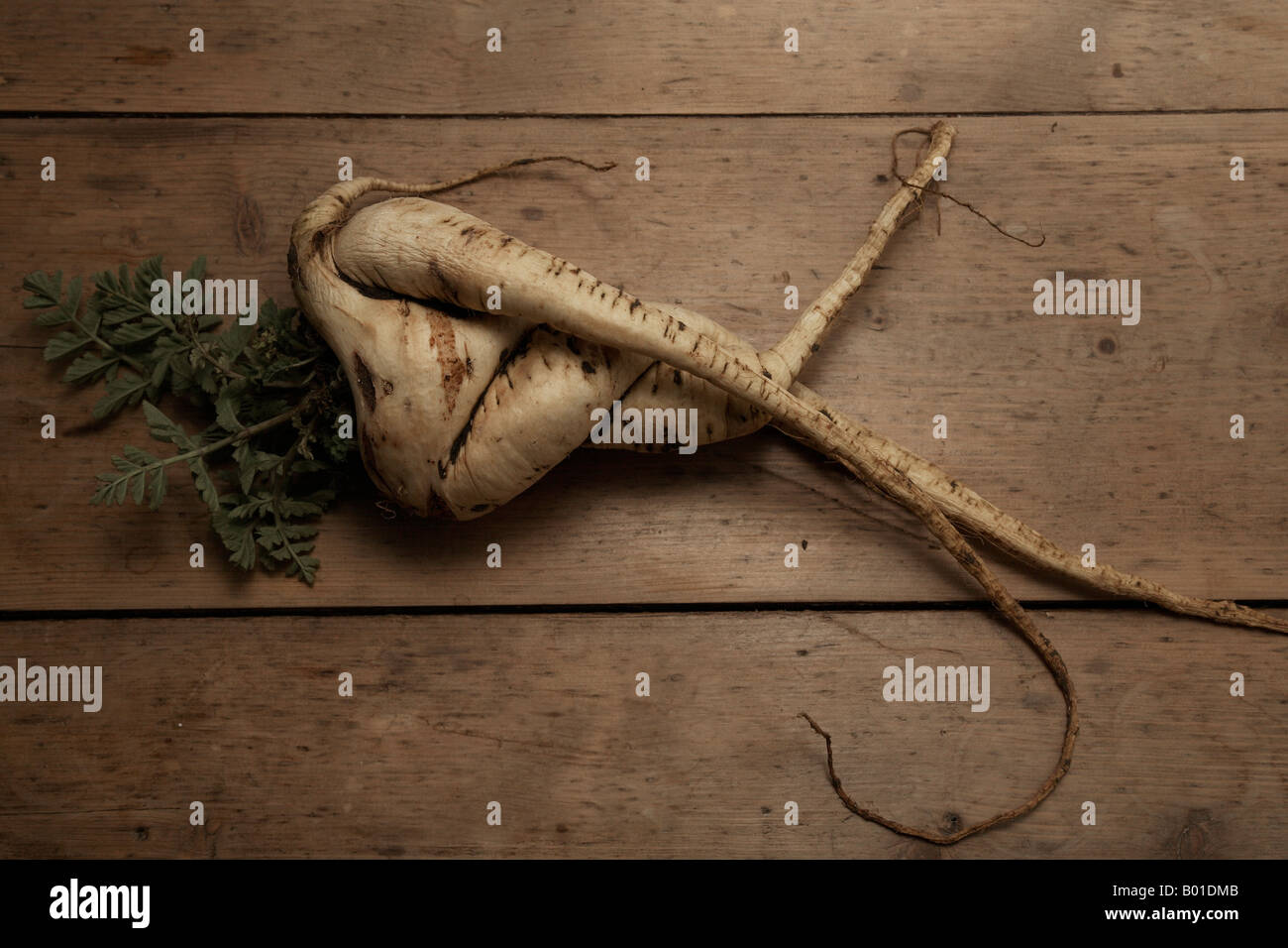 Parsnip on old kitchen table Stock Photo - Alamy